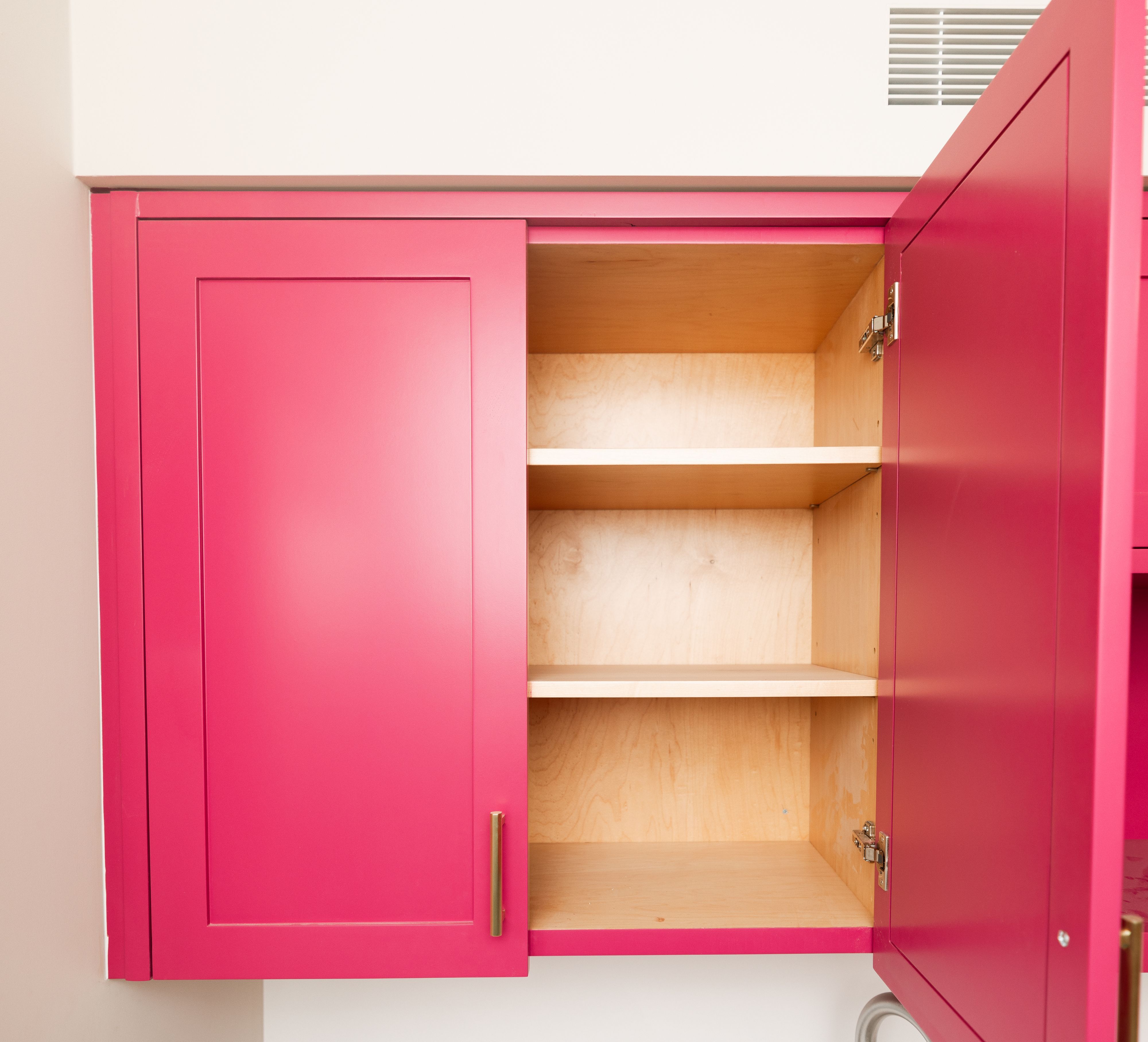 Pink Lacquer Laundry Room by NYC Millwork